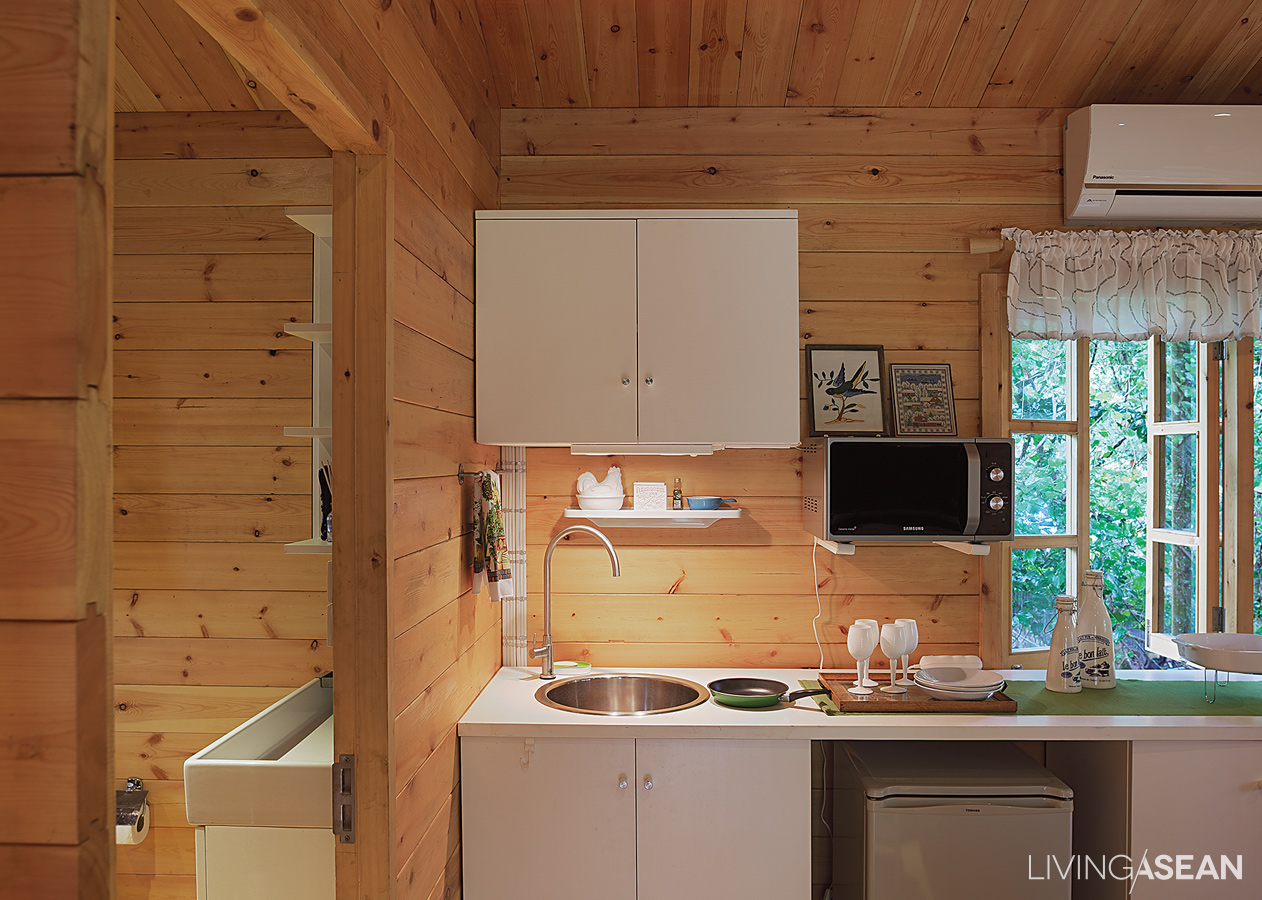 A Little Wood Cabin Nestled in the Lush Green Countryside / Living Asean