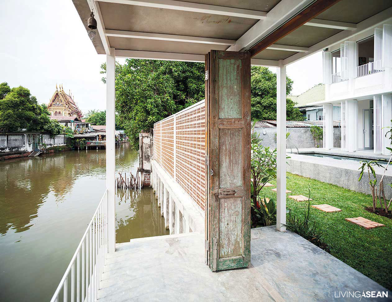 This waterside tropical house brings back memories of Thai life as it ...